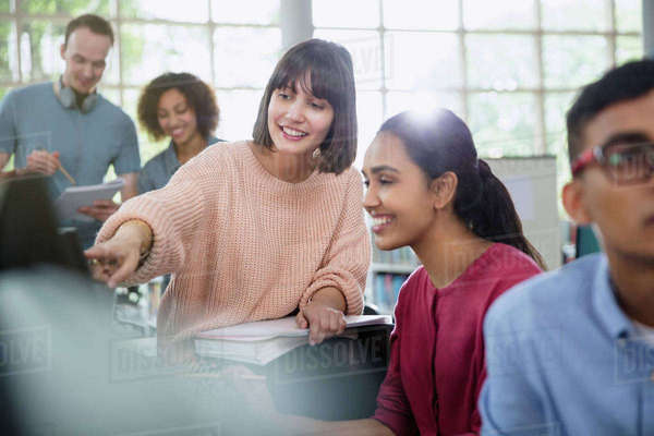 College students talking in classroom - Royalty-free Stock Photo | Dissolve