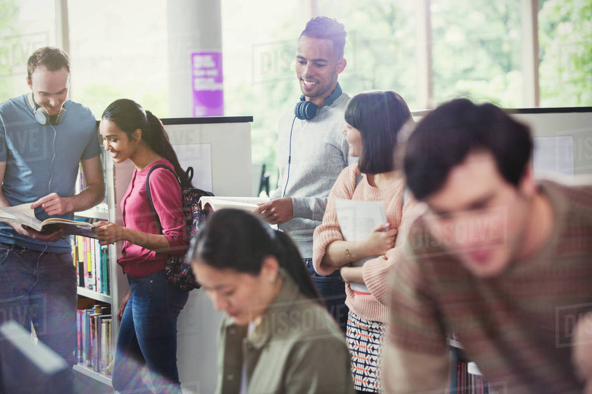College students studying in library - Royalty-free Stock Photo | Dissolve