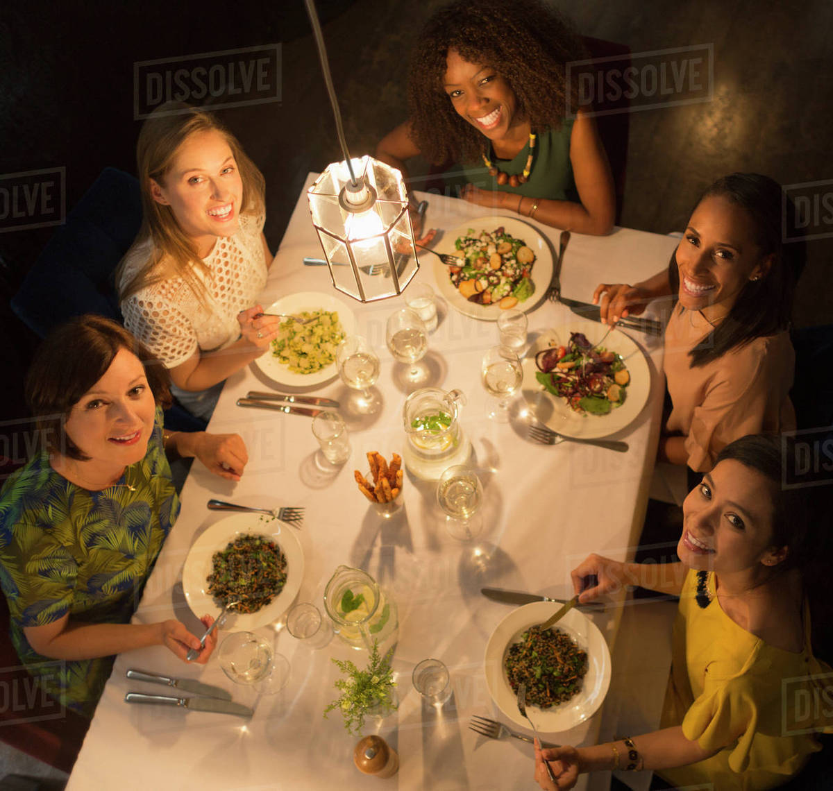 Portrait smiling women friends dining at restaurant table - Royalty ...