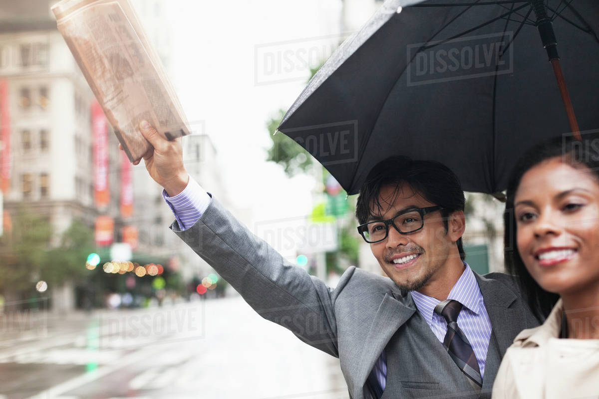 Business people hailing taxi on city street - Royalty-free Stock Photo ...