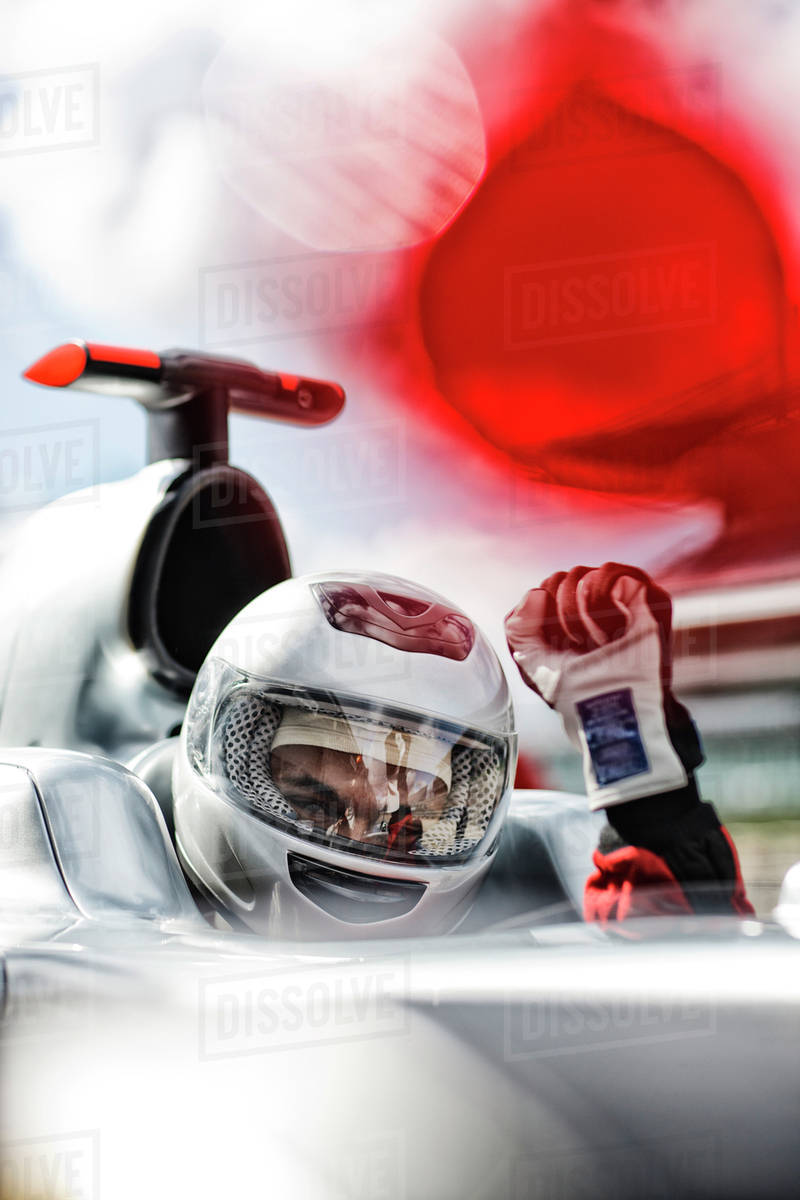 Racer cheering in car on track - Royalty-free Stock Photo | Dissolve