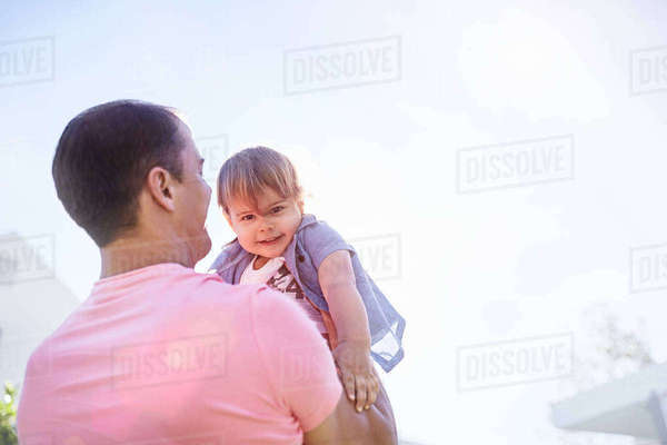 Father lifting baby son - Royalty-free Stock Photo | Dissolve