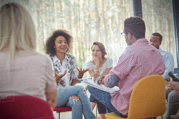 Woman talking in group therapy session - Royalty-free Stock Photo ...