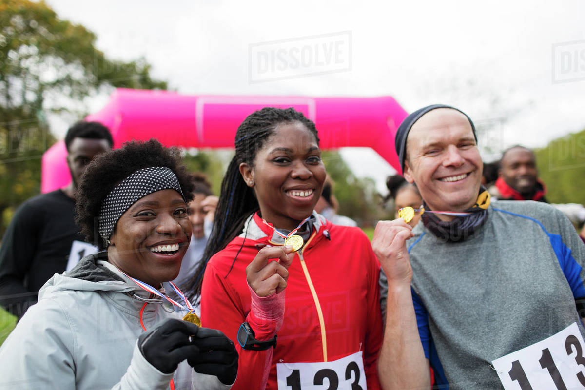 Portrait smiling runners with medals at charity run - Royalty-free ...