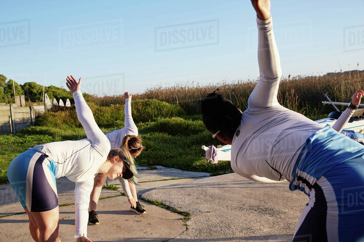 Female rowers stretching, preparing - Royalty-free Stock Photo | Dissolve
