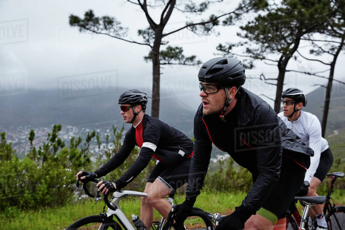 Male cyclists cycling - Royalty-free Stock Photo | Dissolve