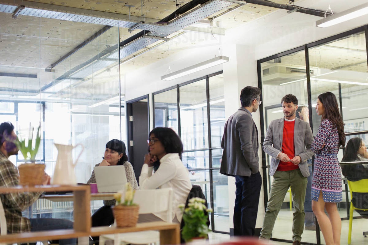 Business people talking and working in office - Stock Photo - Dissolve