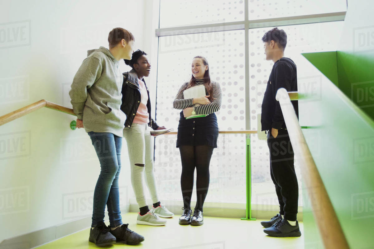 High school students talking on stair landing - Royalty-free Stock ...