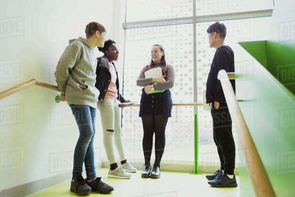 High school students talking on stair landing - Royalty-free Stock ...