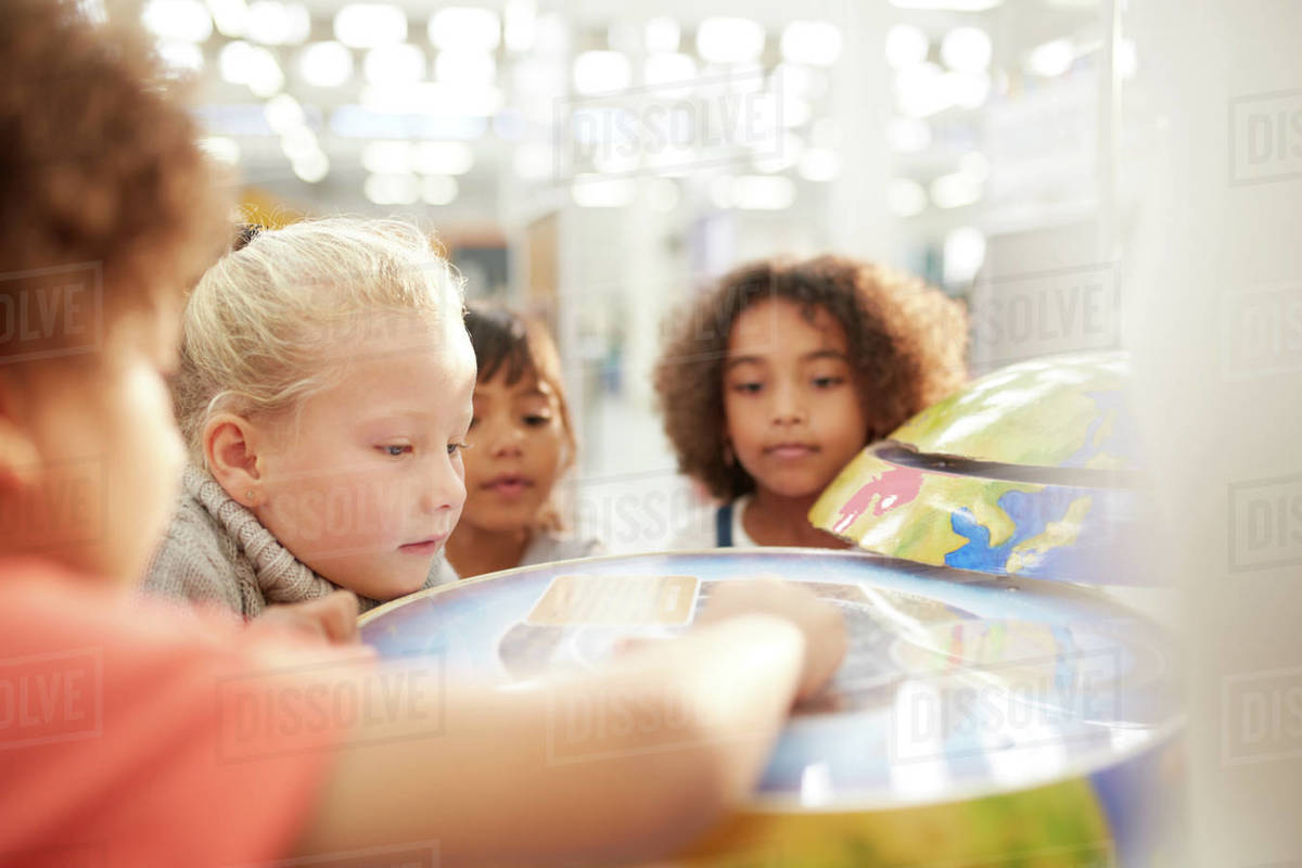 Curious kids at interactive exhibit in science center - Royalty-free ...