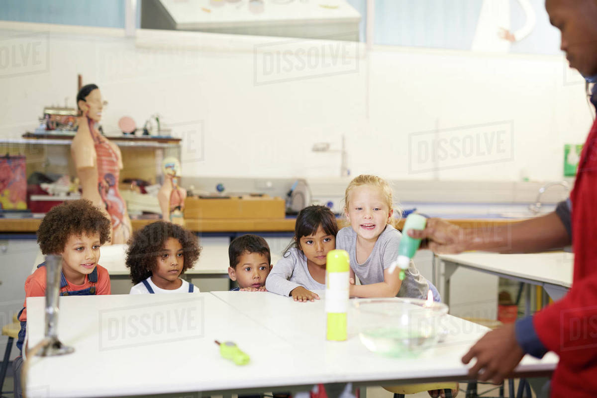 Curious kids watching science experiment in science center - Royalty ...