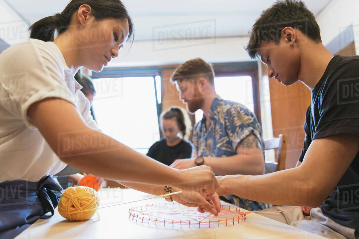 People making string art project - Royalty-free Stock Photo | Dissolve