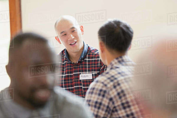 Men talking in group therapy - Royalty-free Stock Photo | Dissolve