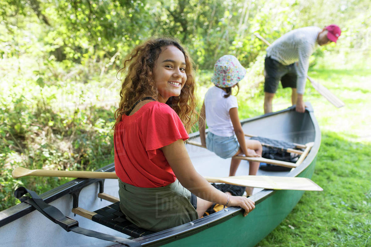 Portrait smiling girl in canoe - Royalty-free Stock Photo | Dissolve
