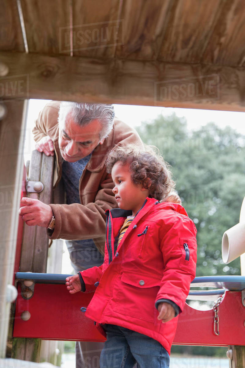 Grandfather and grandson playing at playground - Royalty-free Stock ...