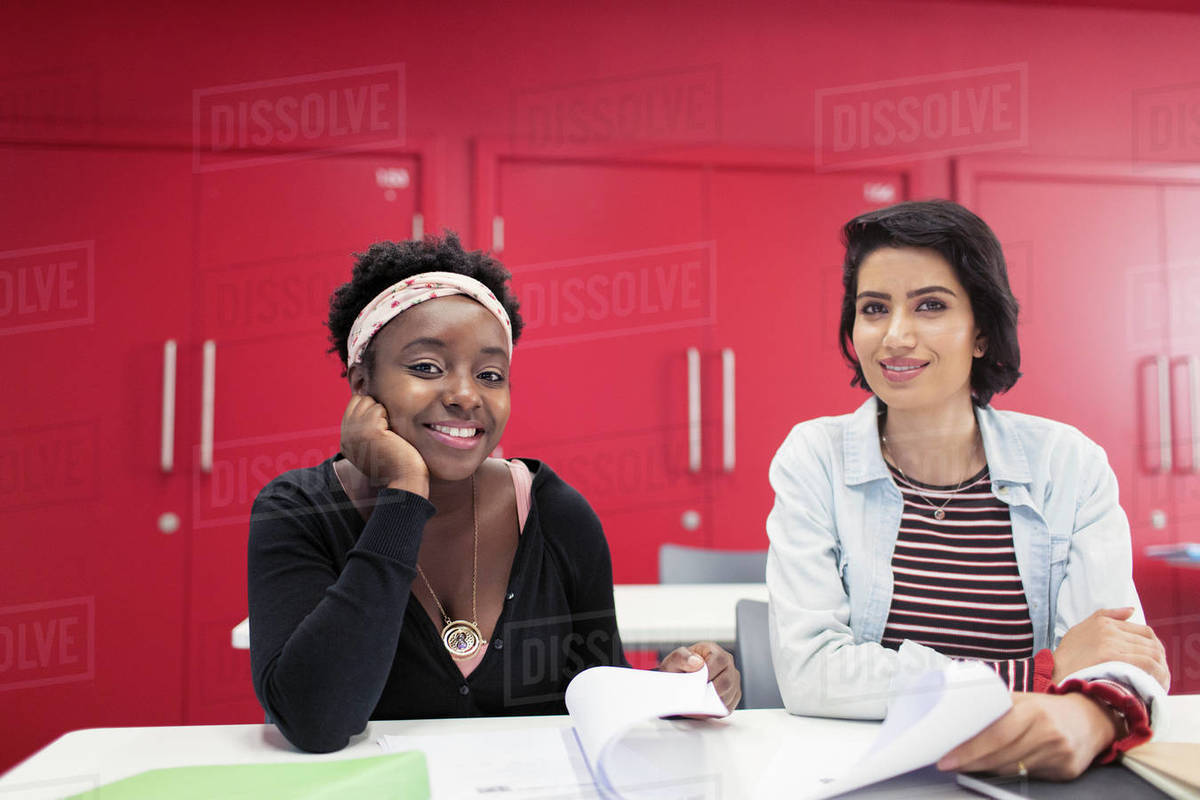 Portrait confident, smiling female community college students with ...