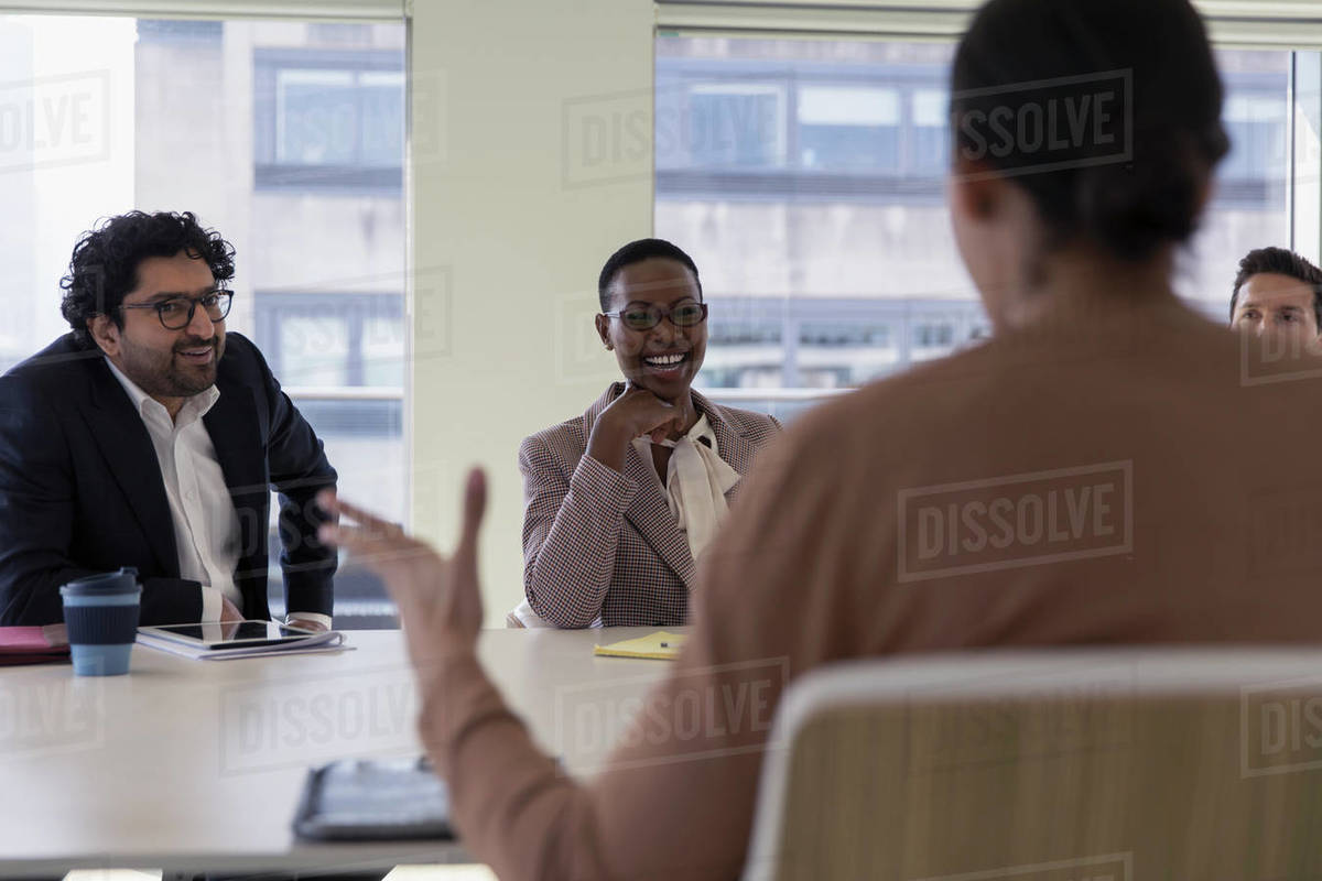 Business people talking in conference room meeting - Stock Photo - Dissolve