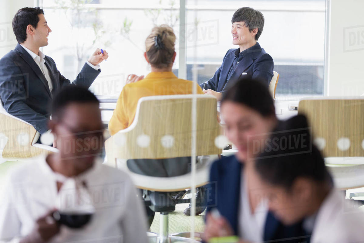 Business people talking in conference room meeting - Stock Photo - Dissolve