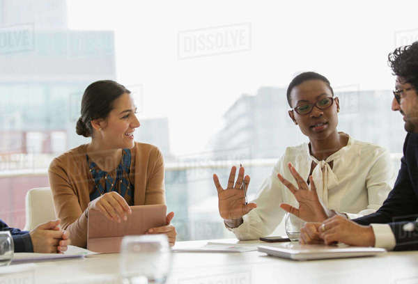 Business people talking in conference room meeting - Stock Photo - Dissolve
