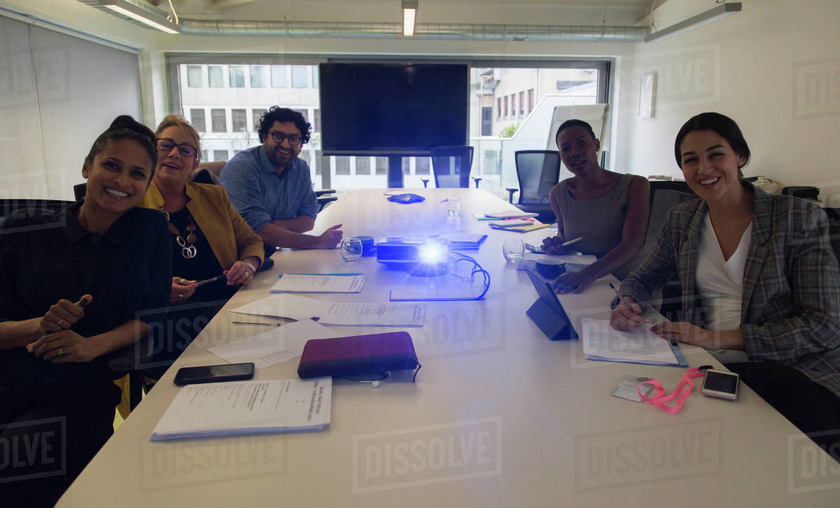 Business people watching projection presentation in conference room ...