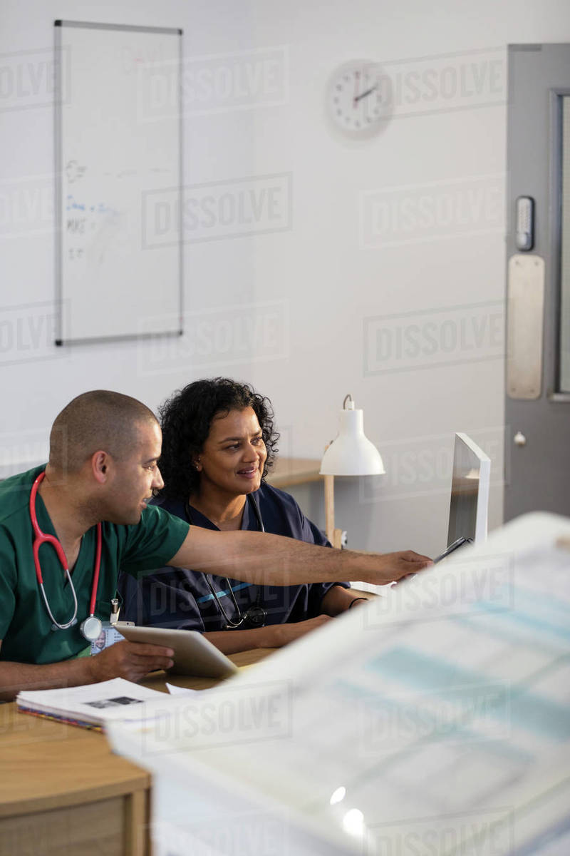 Nurses working at computer in clinic - Royalty-free Stock Photo | Dissolve