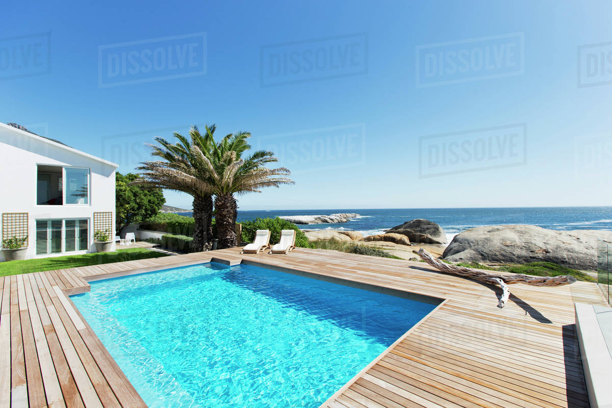 Luxury swimming pool with ocean view - Royalty-free Stock Photo | Dissolve