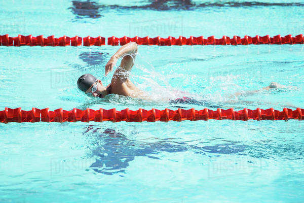 Swimmer racing in pool - Royalty-free Stock Photo | Dissolve