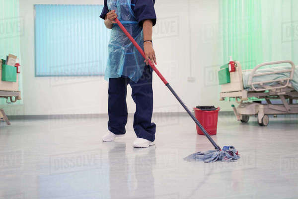 Female orderly mopping hospital ward floor - Royalty-free Stock Photo ...
