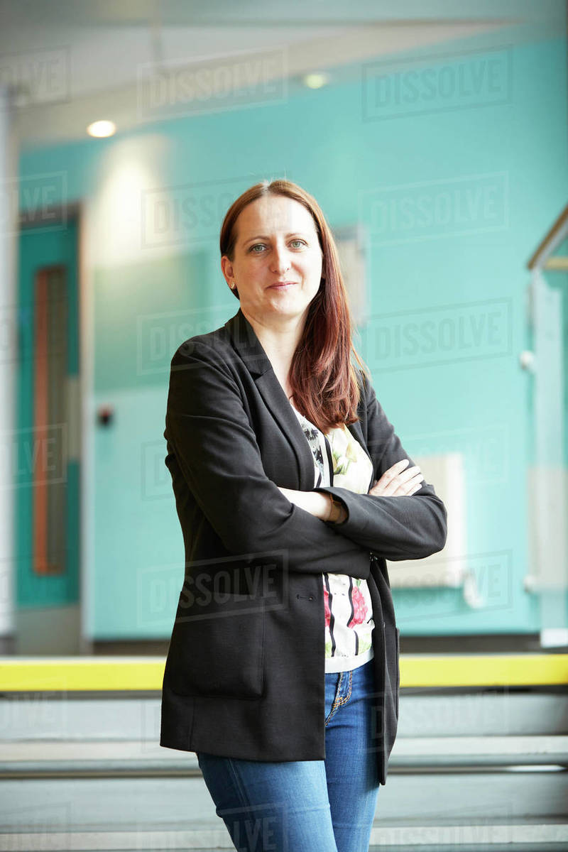 Portrait confident female teacher with arms crossed - Stock Photo ...