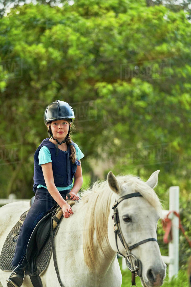 Portrait confident girl horseback riding - Royalty-free Stock Photo ...