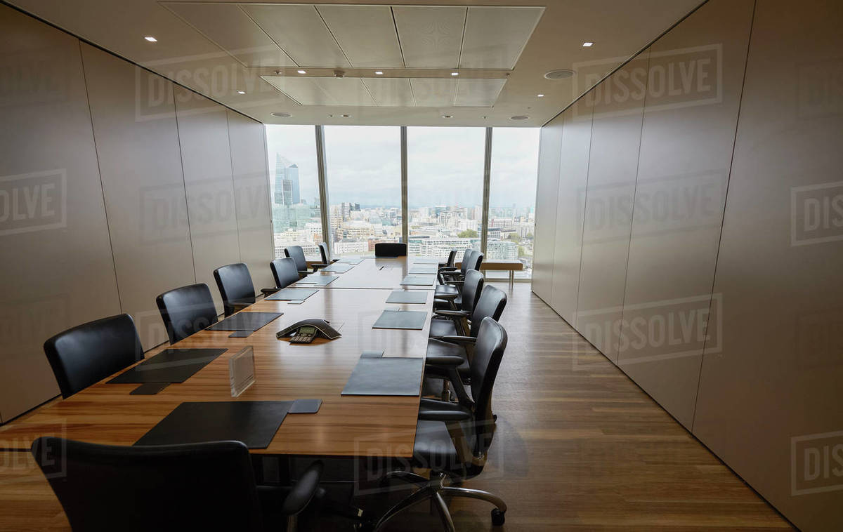 Long wood conference room table - Royalty-free Stock Photo | Dissolve