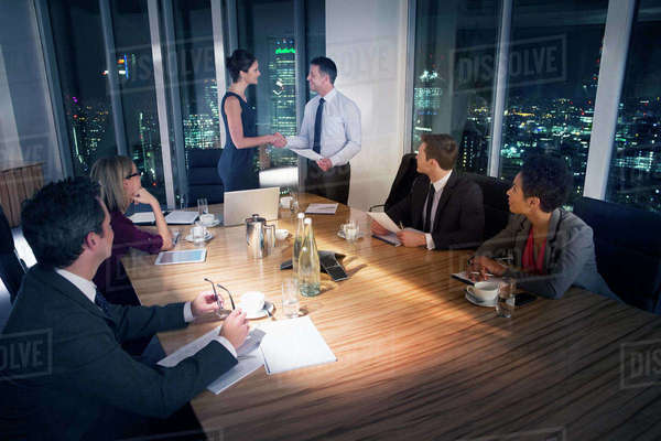 Business people meeting in conference room at night - Stock Photo ...