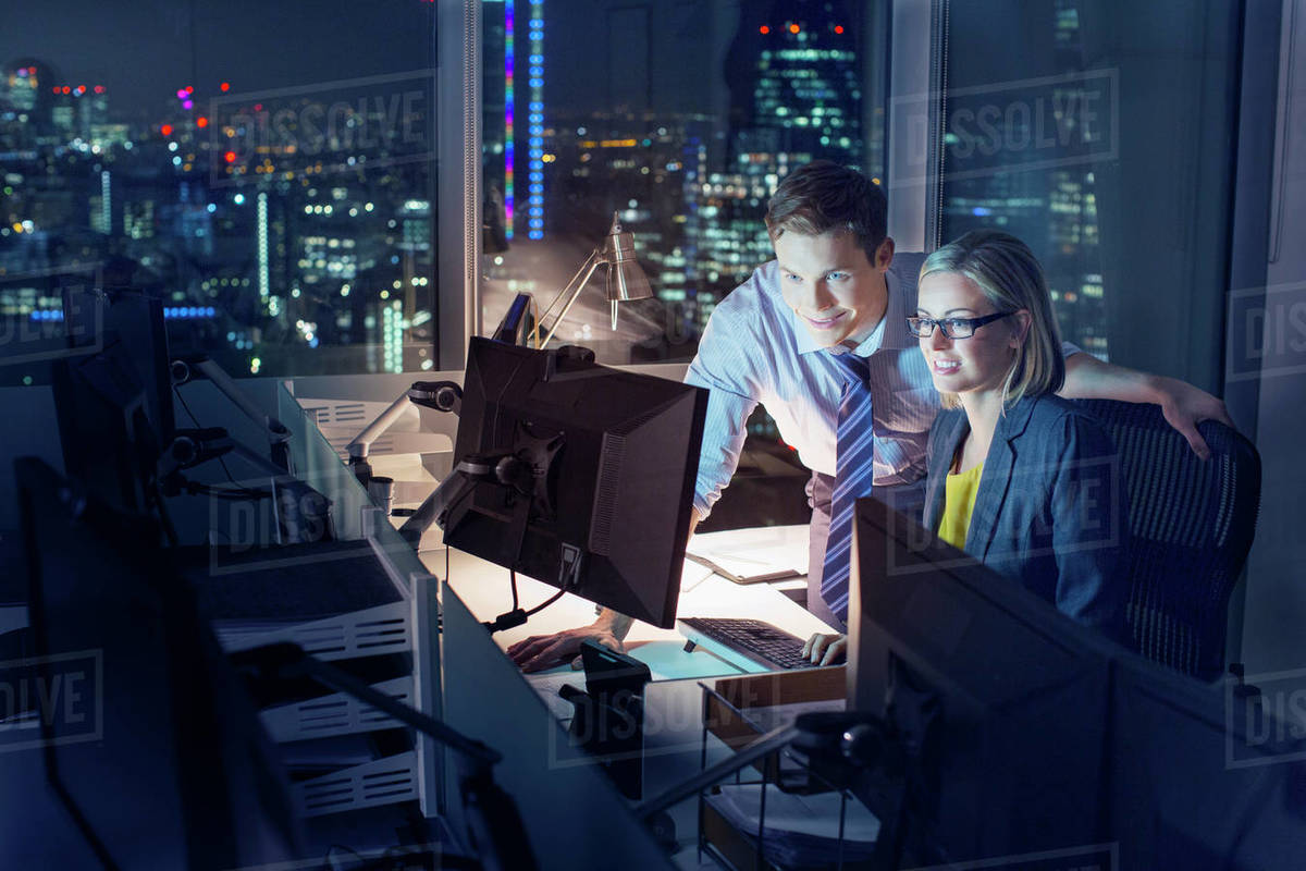 Business people working late at computer in office - Royalty-free Stock ...