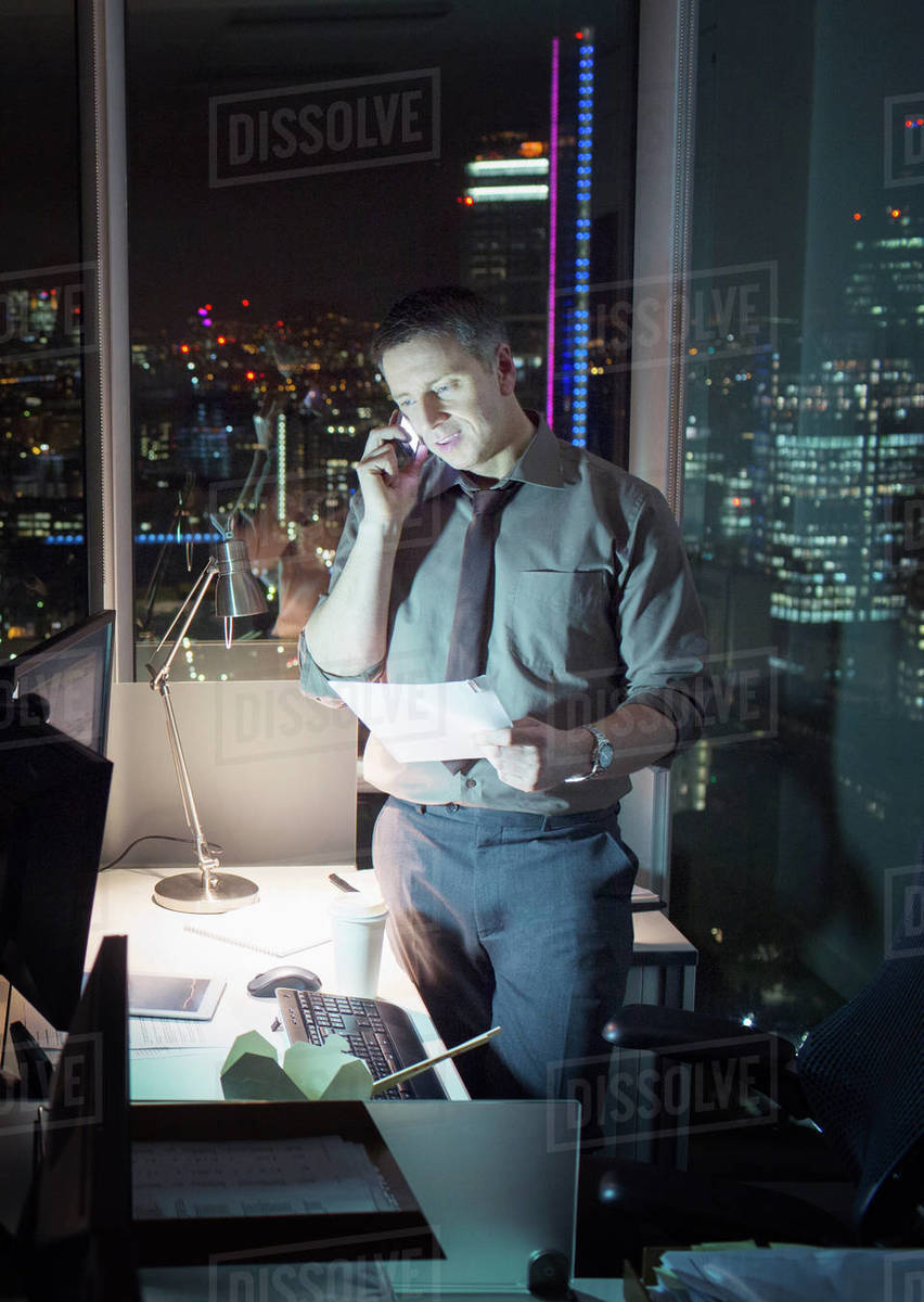 Businessman working late in office - Royalty-free Stock Photo | Dissolve