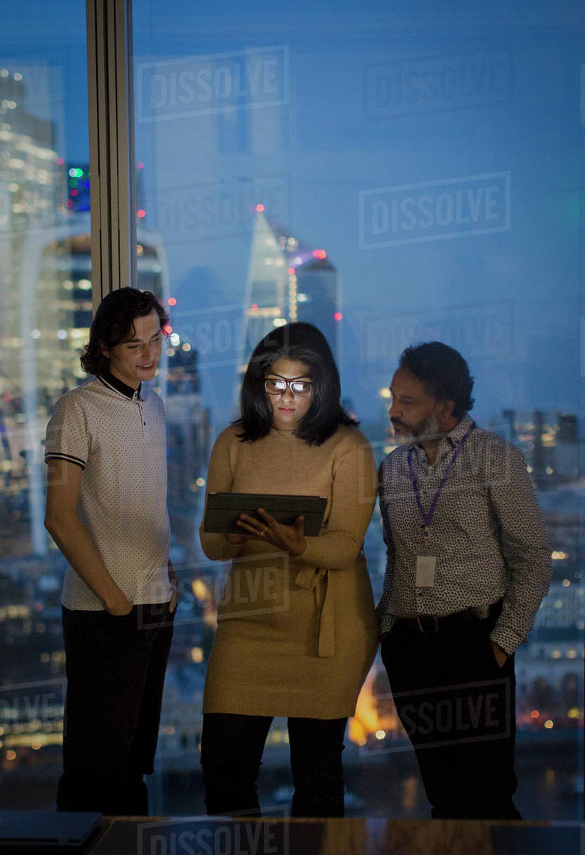 Business people working late in highrise office, London, UK - Stock ...