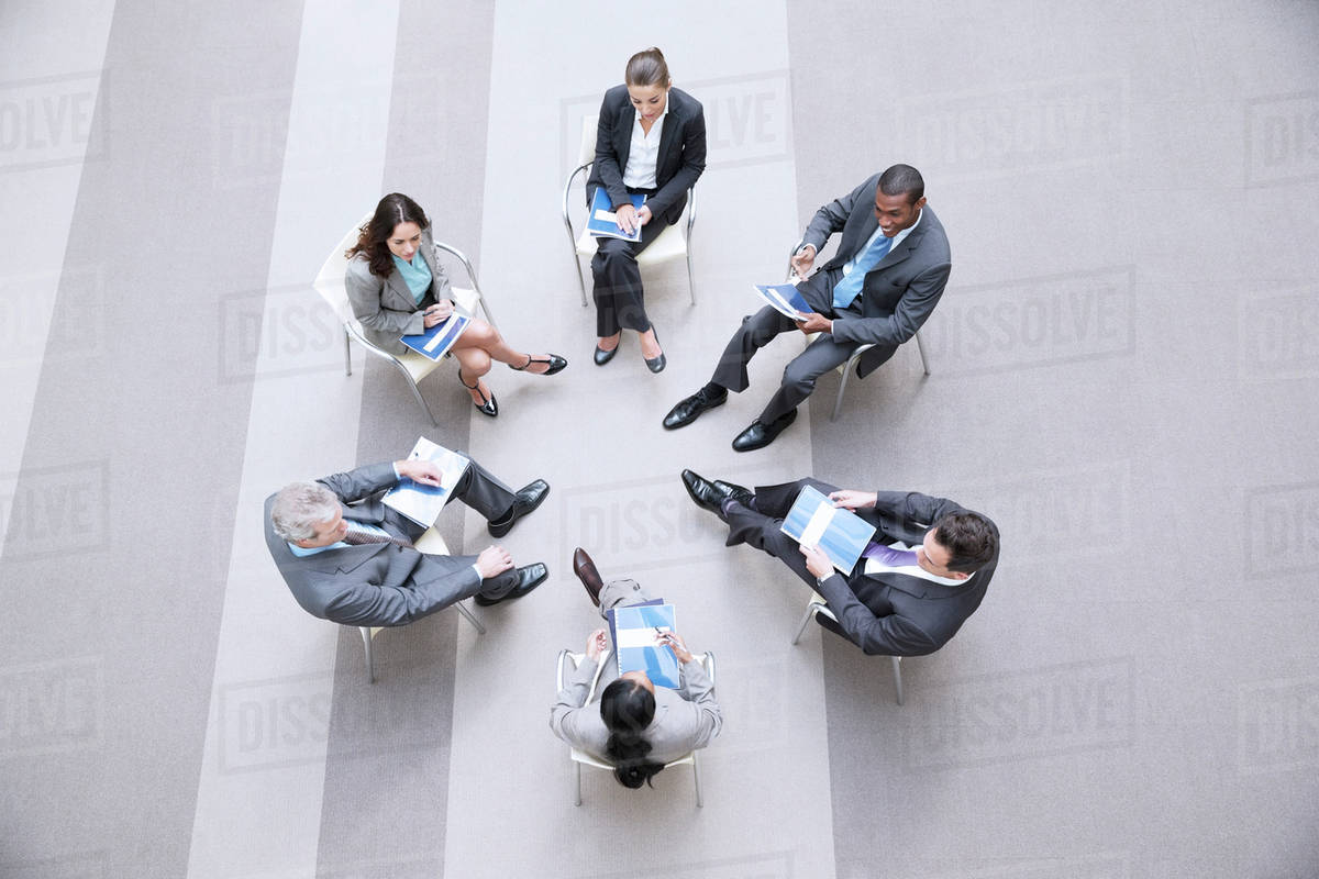 High angle view of business people sitting in circle - Royalty-free ...