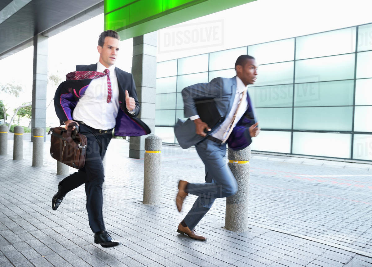 Businessmen running - Stock Photo - Dissolve