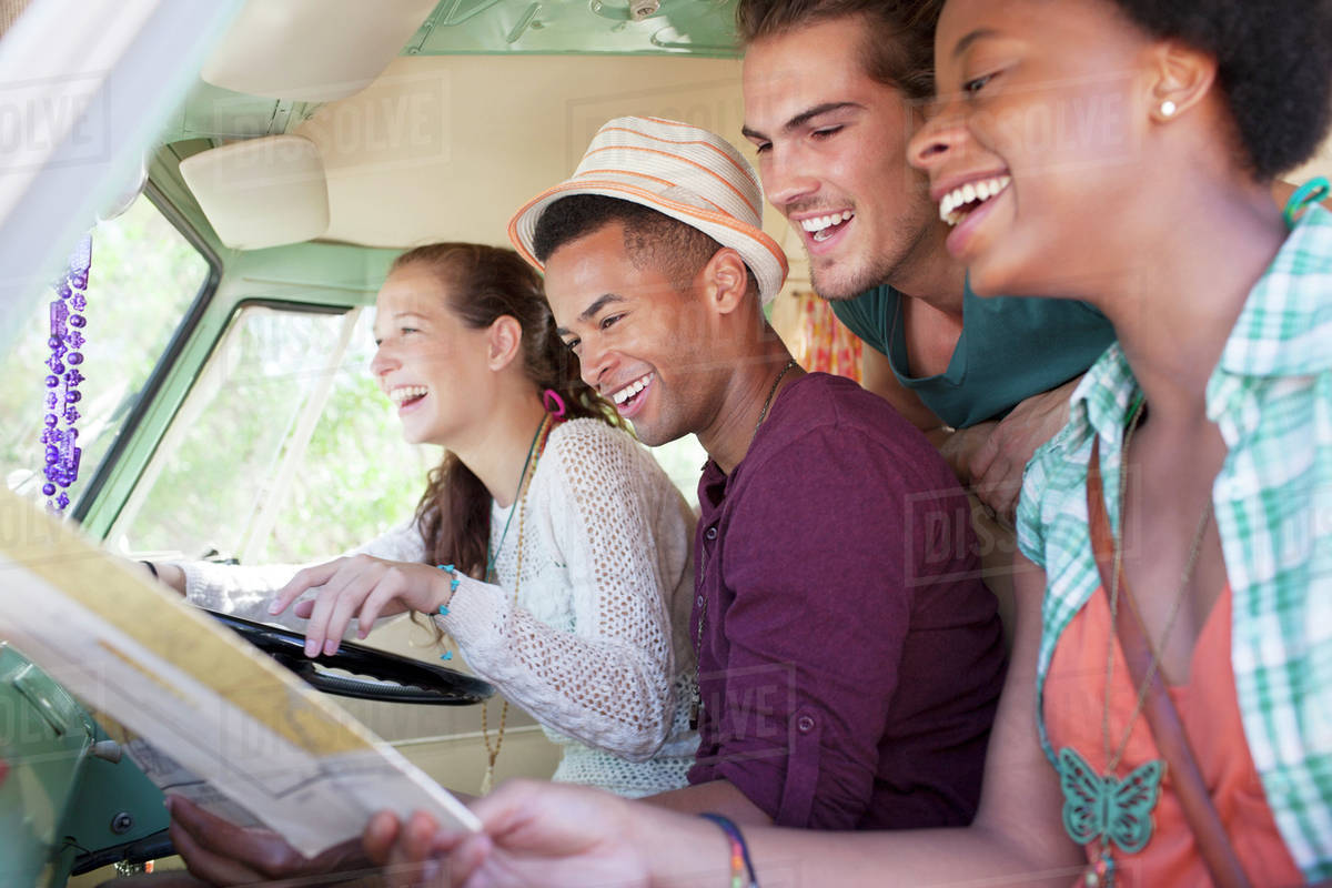 Smiling friends in van - Royalty-free Stock Photo | Dissolve