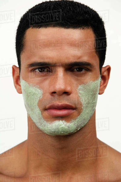 Man wearing avocado face mask - Stock Photo - Dissolve