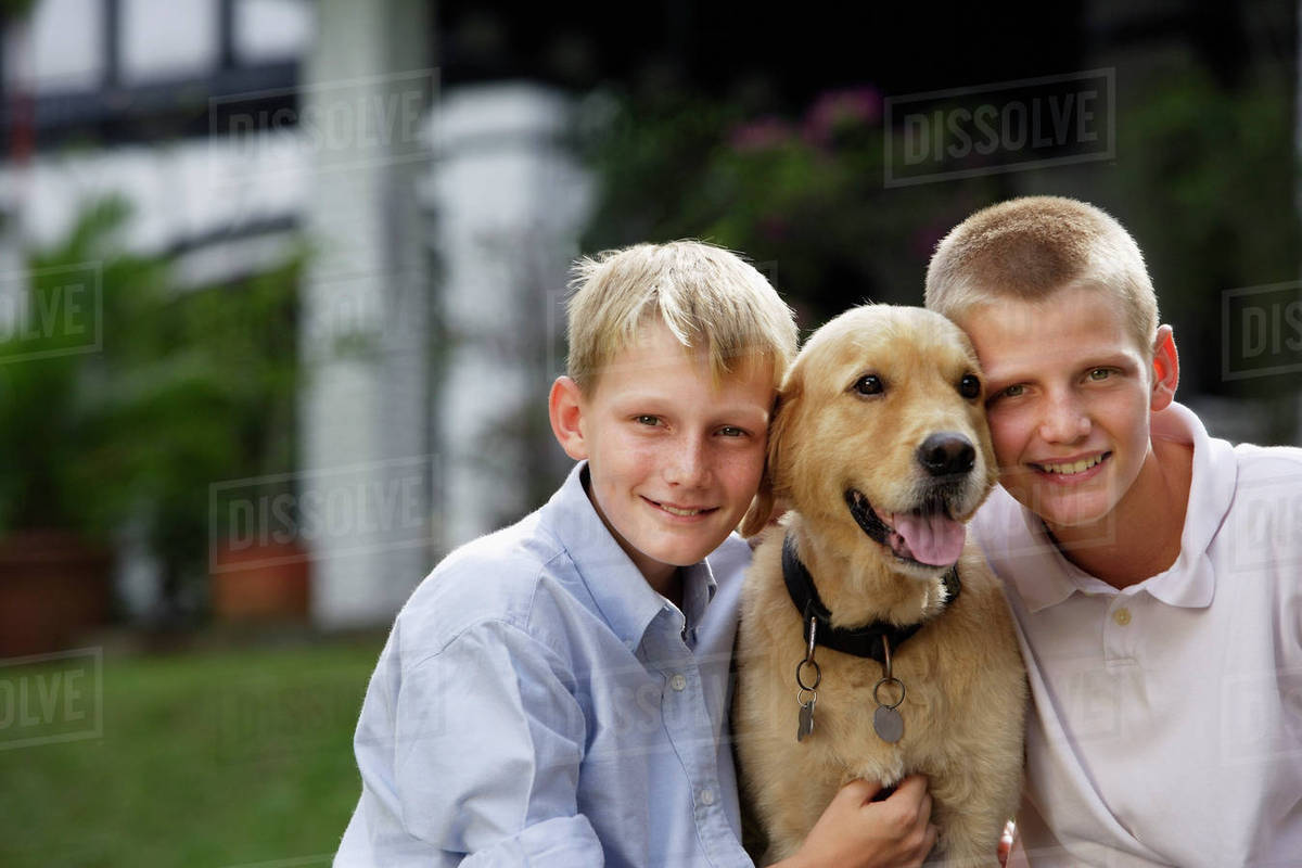 Two boys with dog - Royalty-free Stock Photo | Dissolve