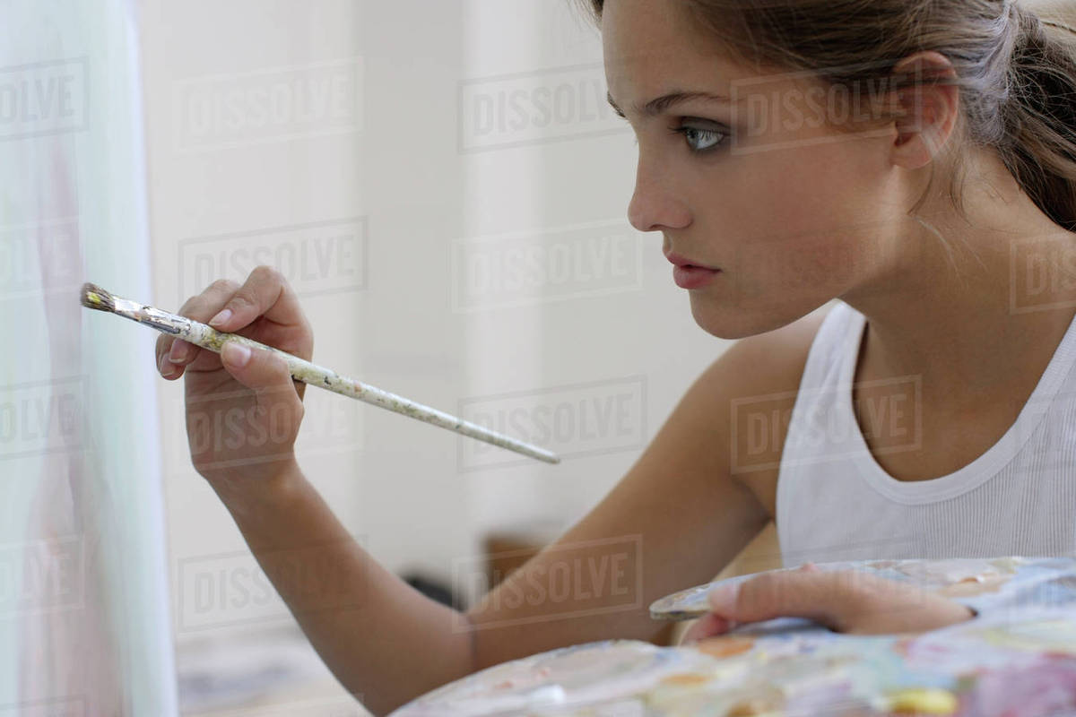 Artist working on painting - Royalty-free Stock Photo | Dissolve