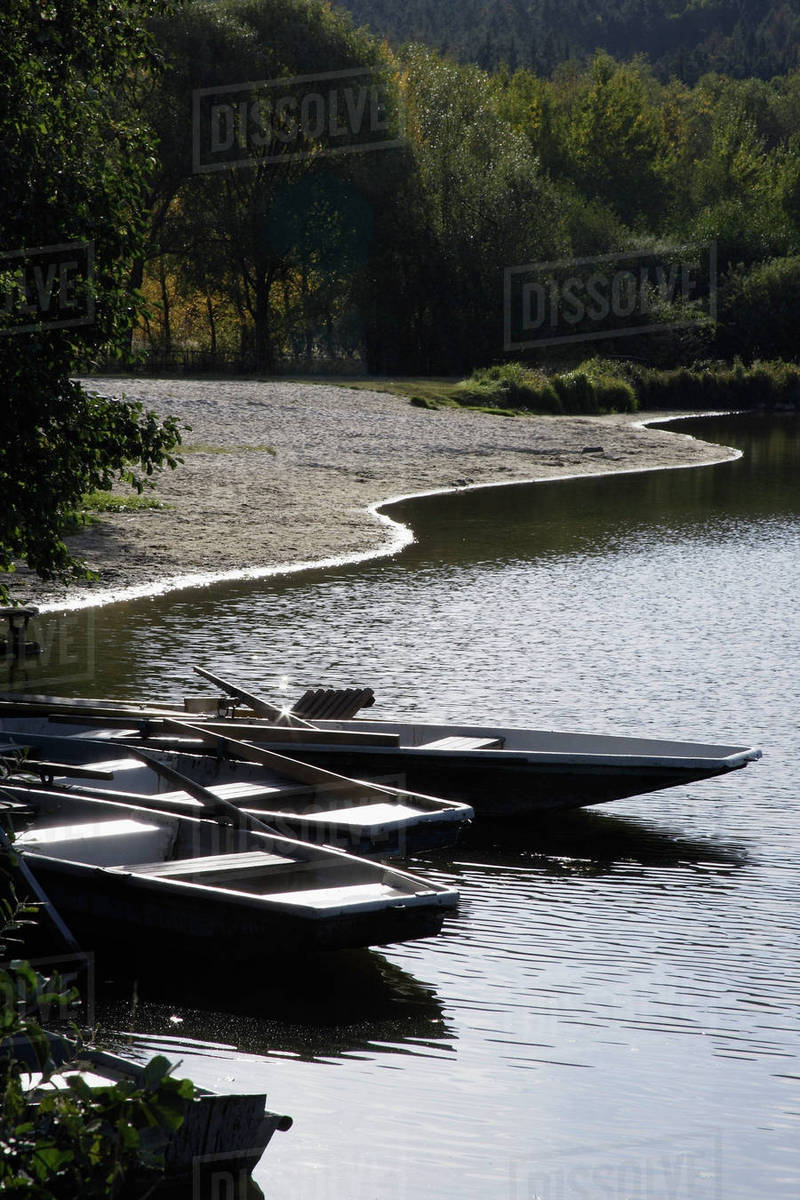 Row boats in river - Stock Photo - Dissolve