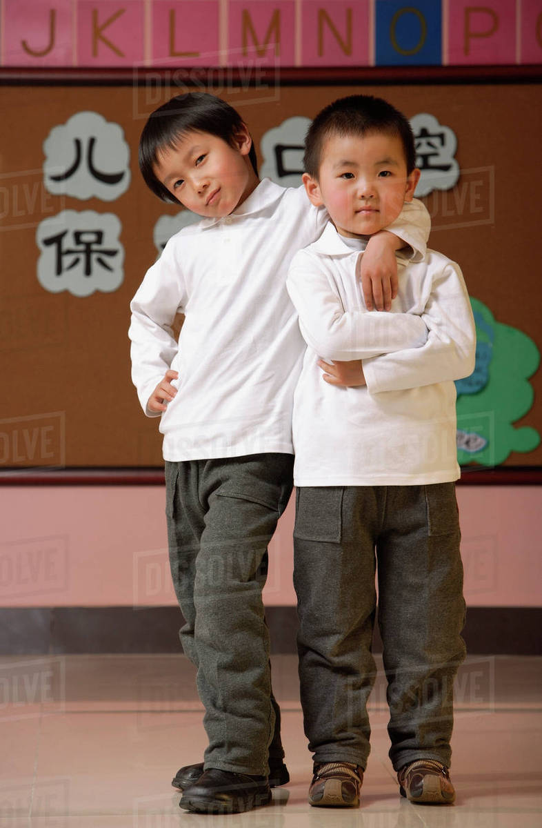 Schoolboys in class looking at camera - Stock Photo - Dissolve