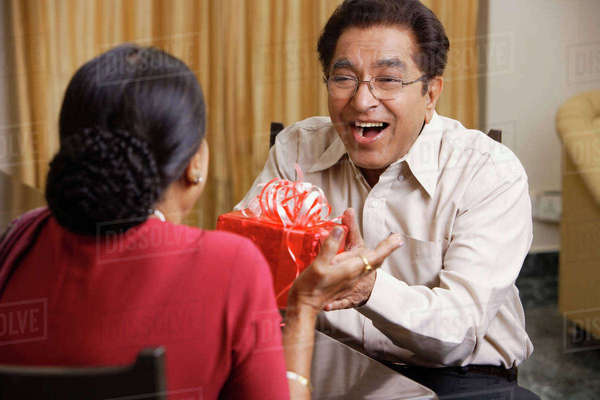 Man giving woman gift - Royalty-free Stock Photo | Dissolve