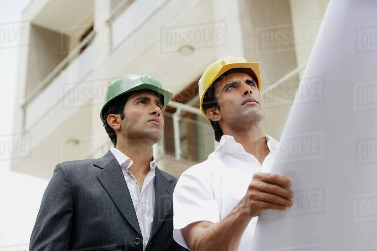 Contractors or architects with blueprints - Royalty-free Stock Photo ...