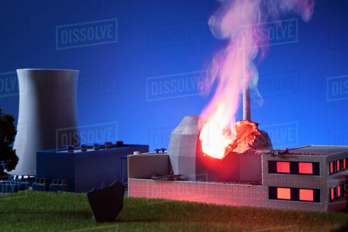 A model built to scale of a nuclear power plant on fire - Royalty-free ...