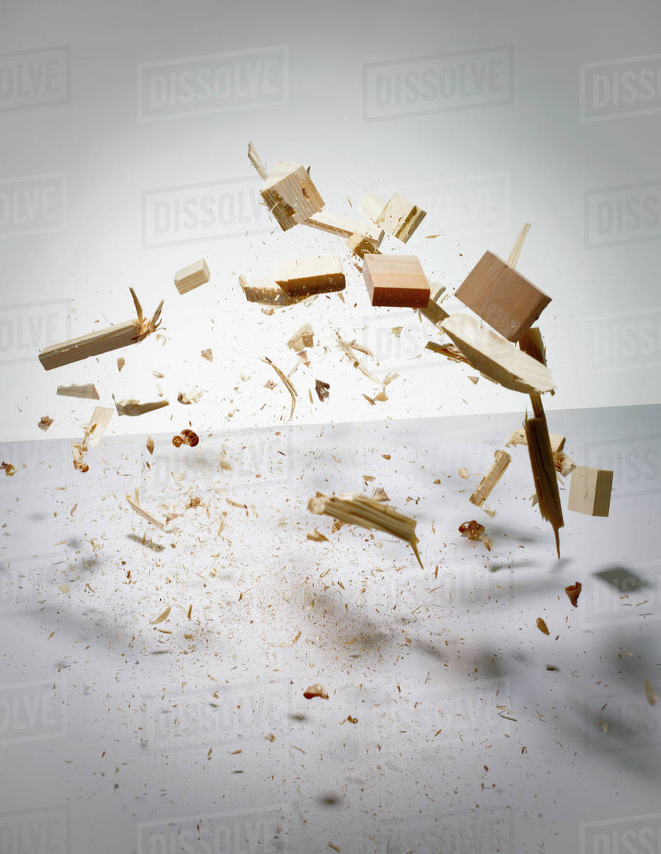 Wood exploding into pieces - Stock Photo - Dissolve