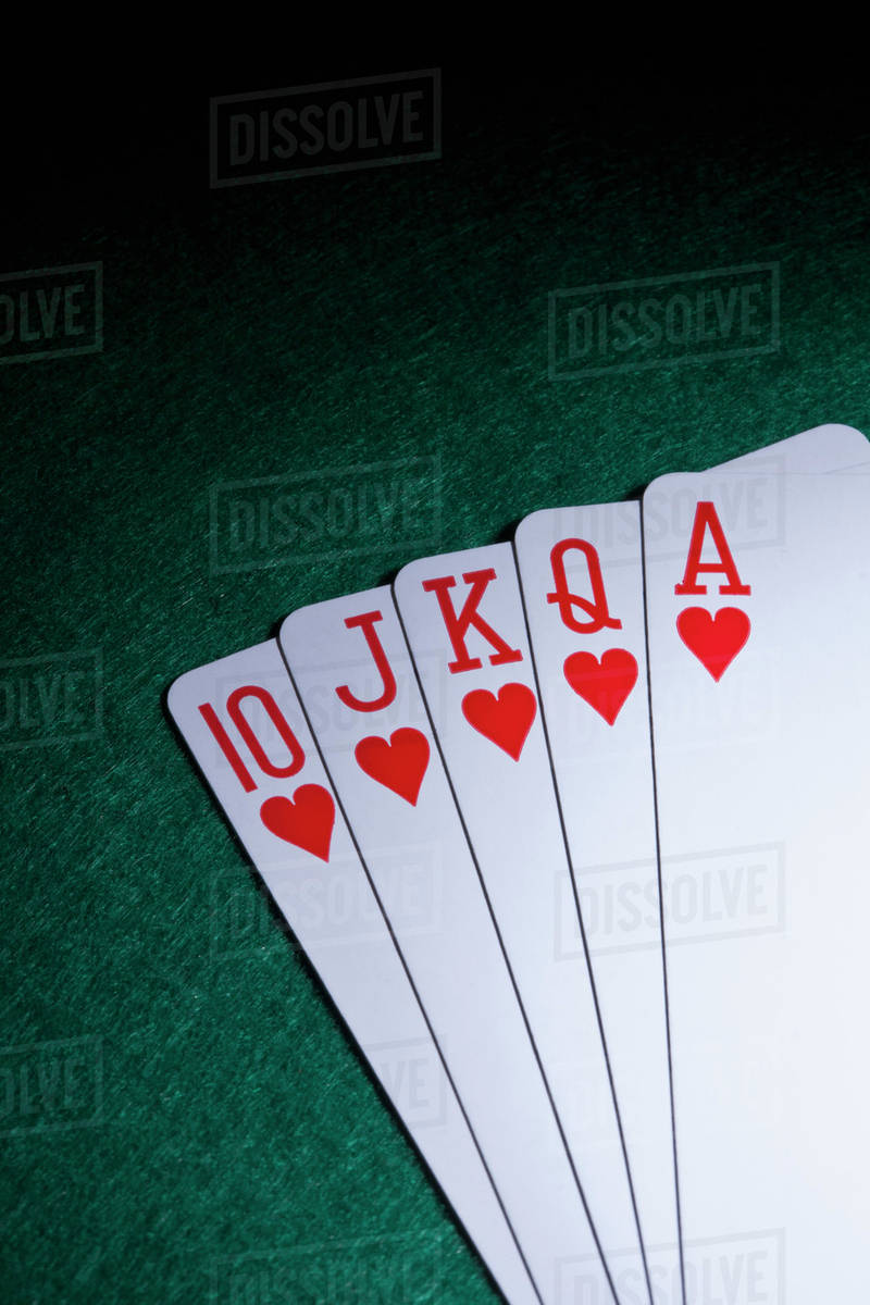 A straight flush fanned out on a table - Stock Photo - Dissolve