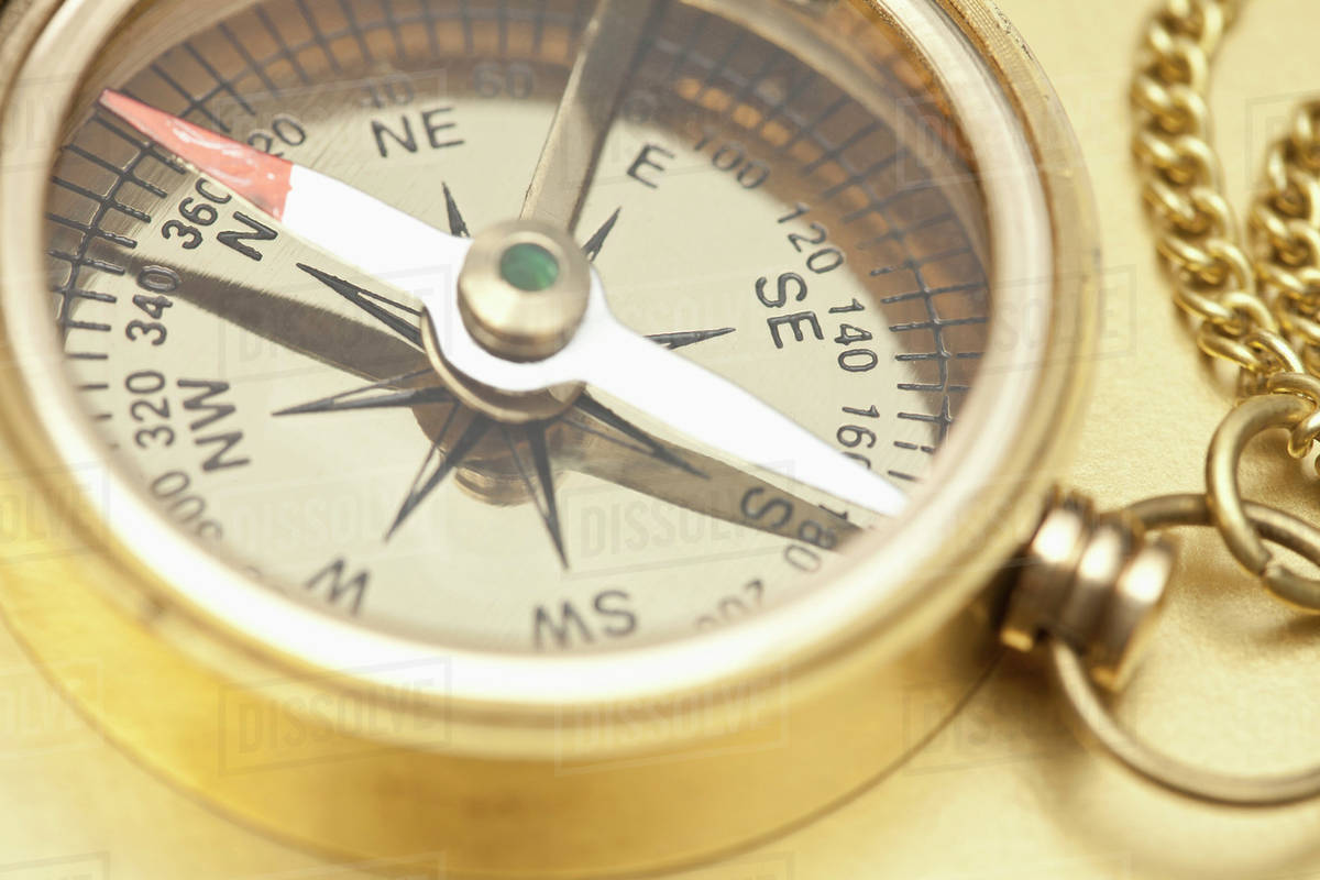 A brass pocket compass, close-up - Royalty-free Stock Photo | Dissolve