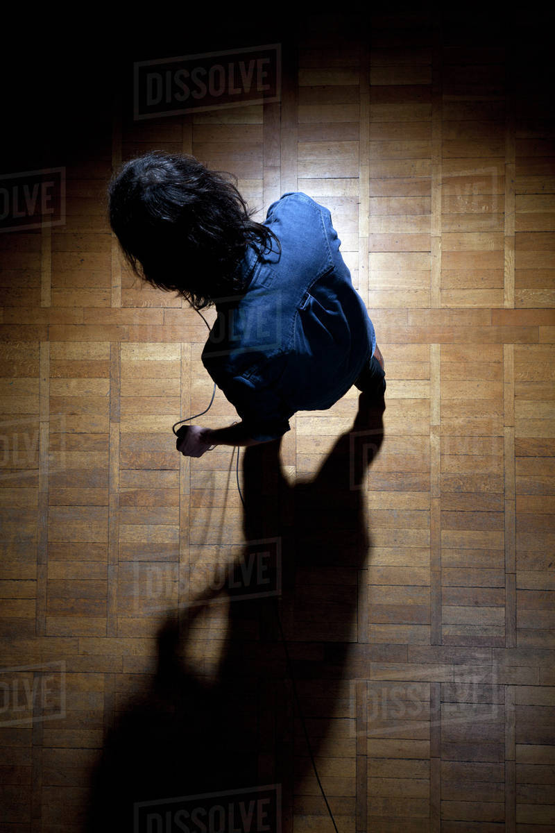 Rock singer on stage in spotlight - Royalty-free Stock Photo | Dissolve